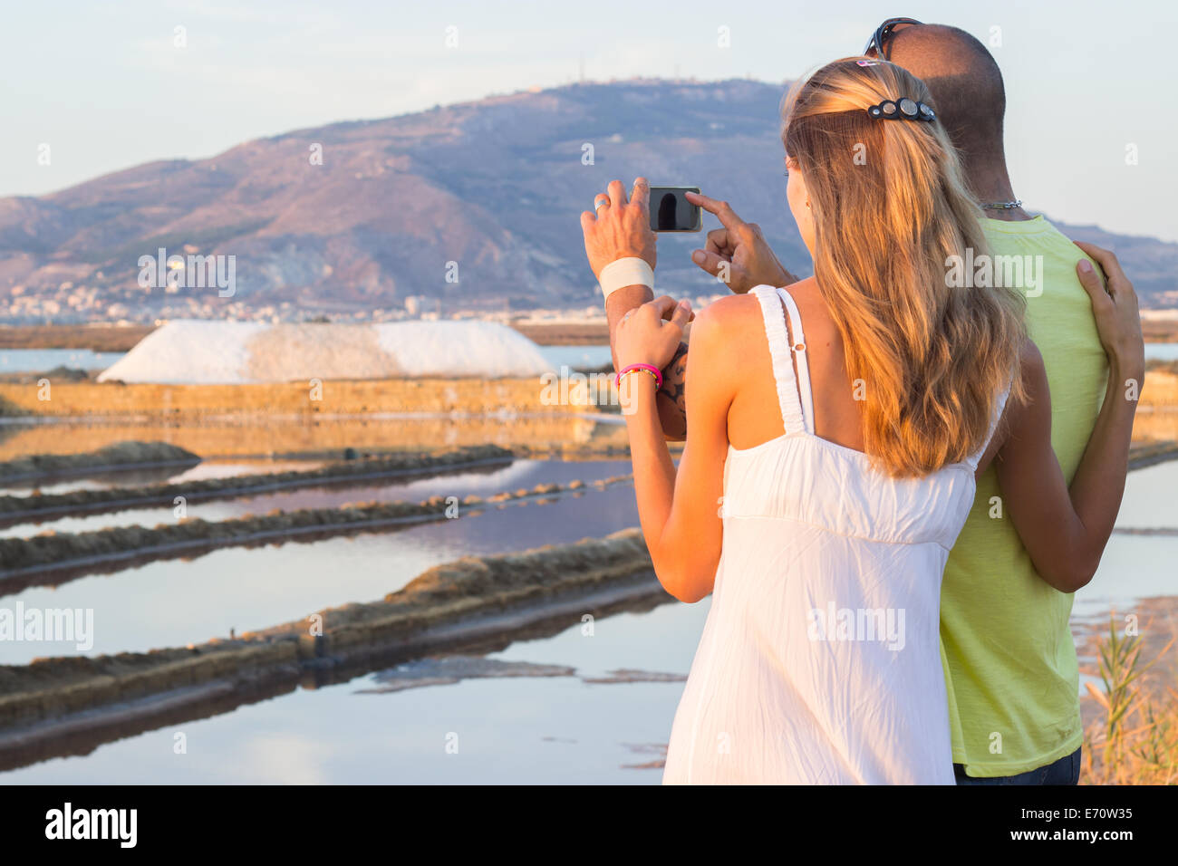couple man woman photographing "salt marsh" salt mounds landscape Erice ...