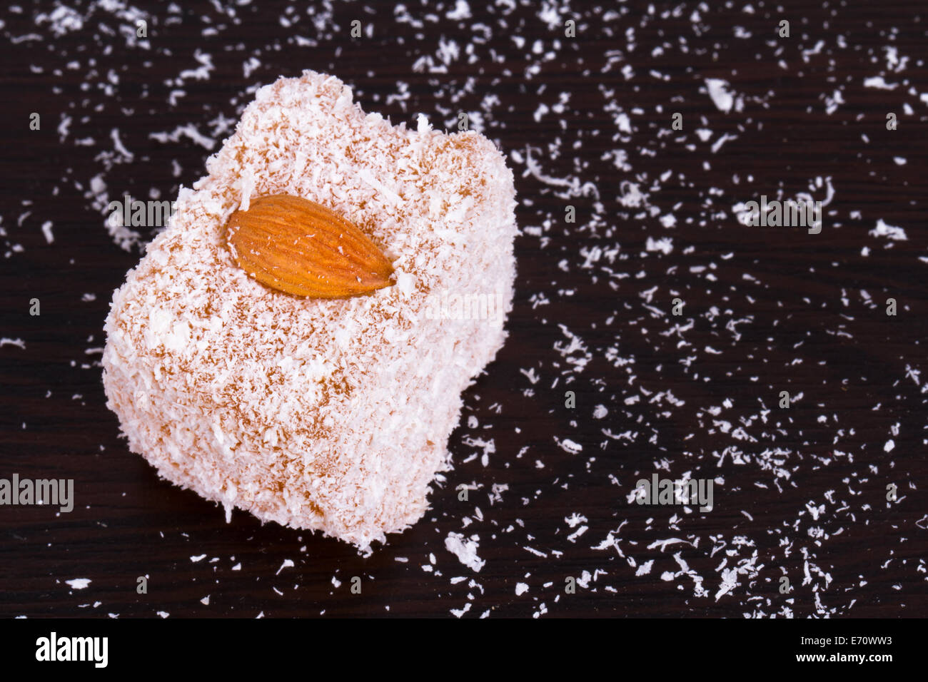 Single Turkish delights on wooden table Stock Photo - Alamy