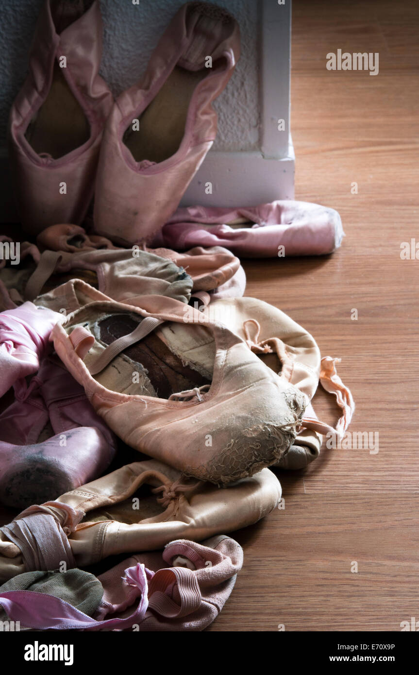 Group of pointe shoes on wooden floor Stock Photo - Alamy