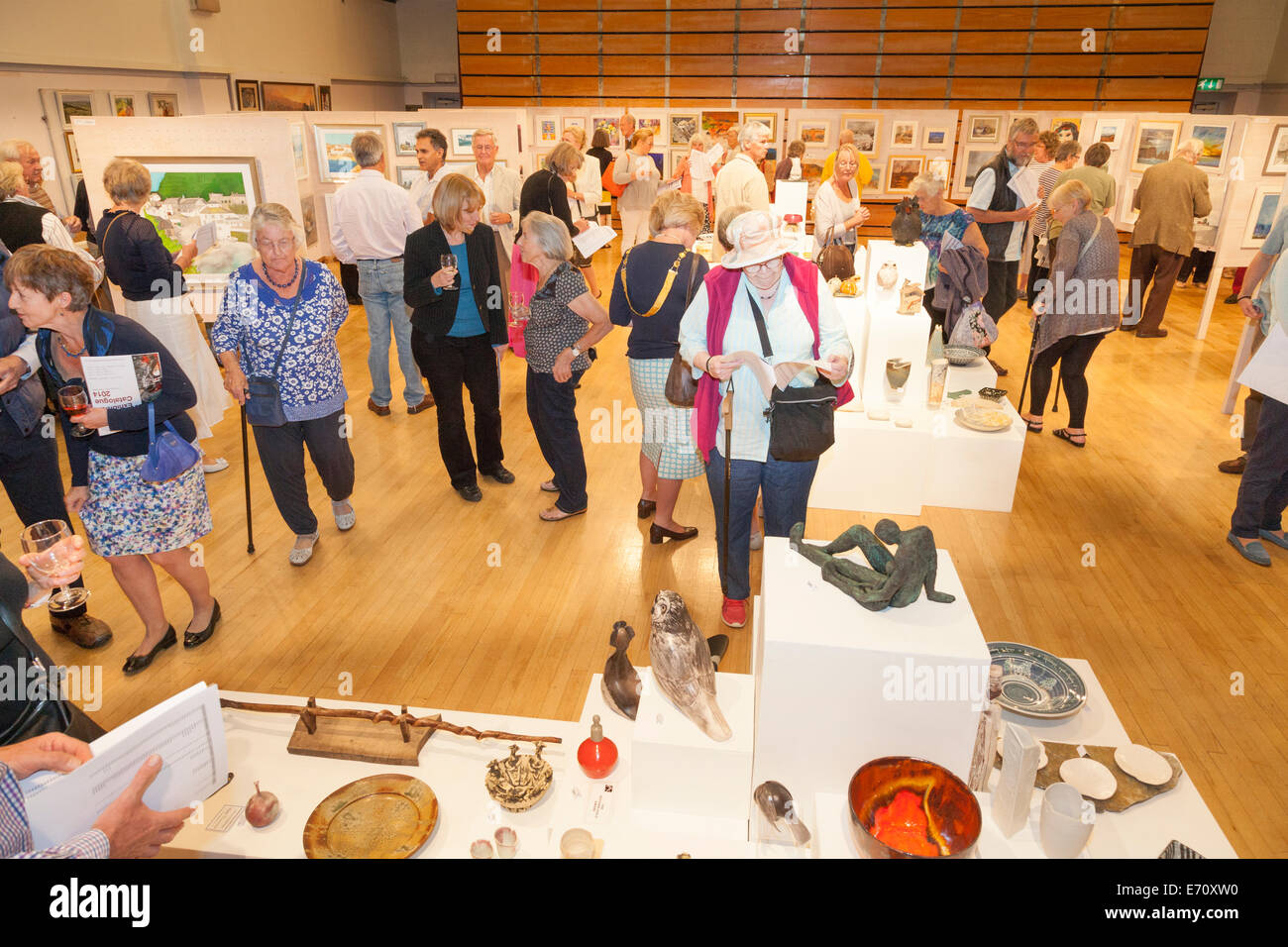 Guests crowd the exhibition hall to view the exhibits at the ...