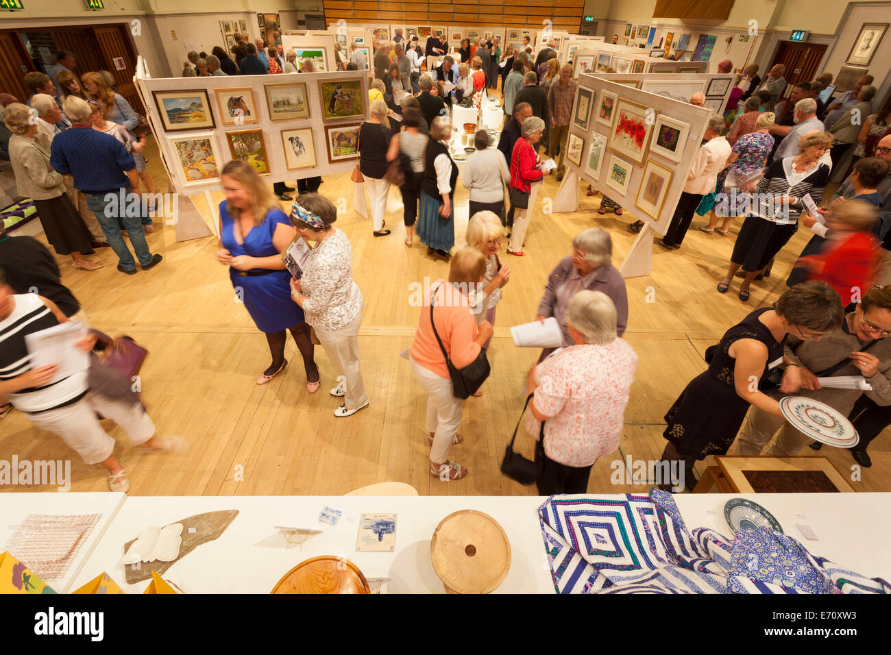 Guests crowd the exhibition hall to view the exhibits at the ...