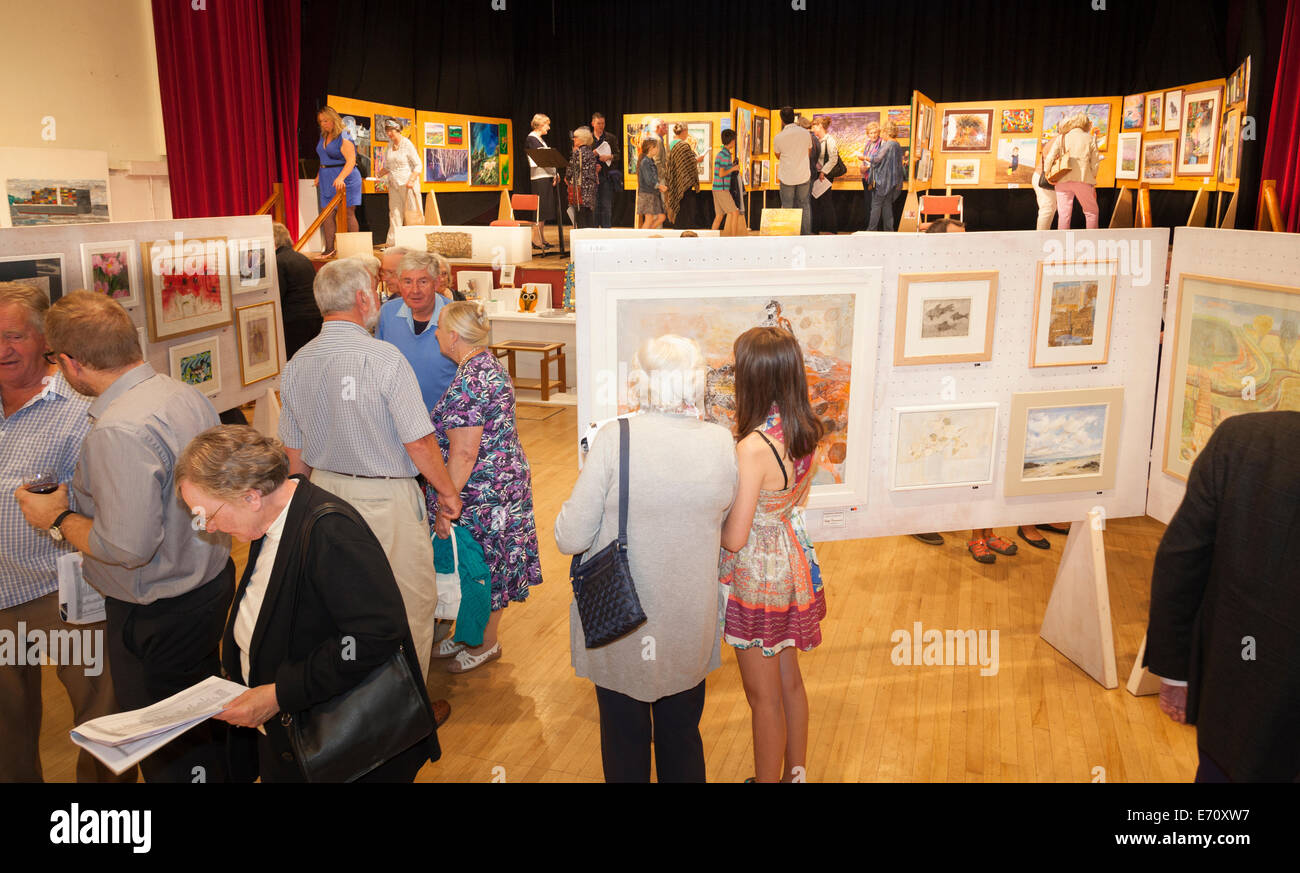 Guests crowd the exhibition hall to view the exhibits at the ...