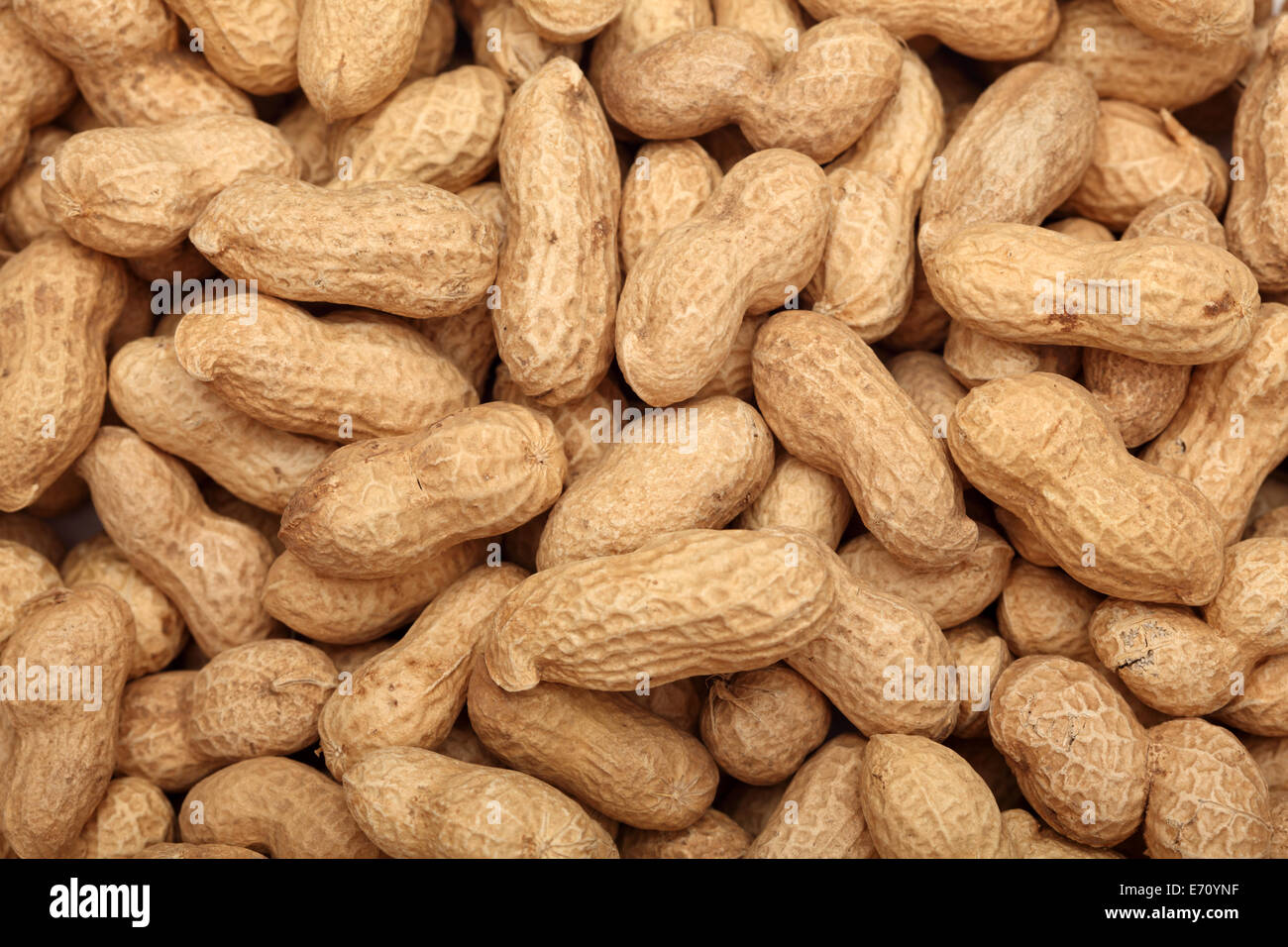 Peanuts background. Closeup Stock Photo - Alamy