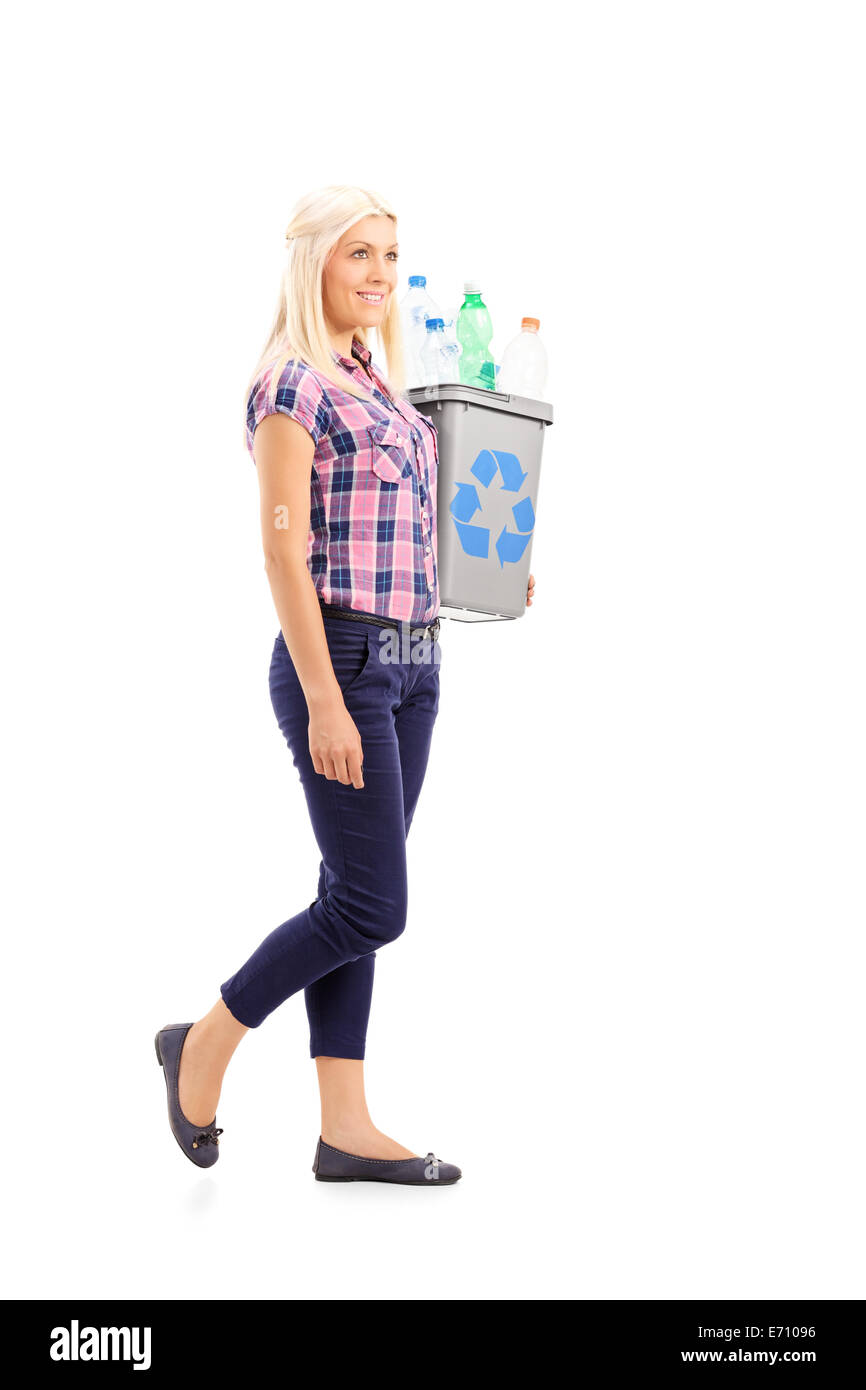 Profile shot of a woman carrying a recycle bin isolated on white ...