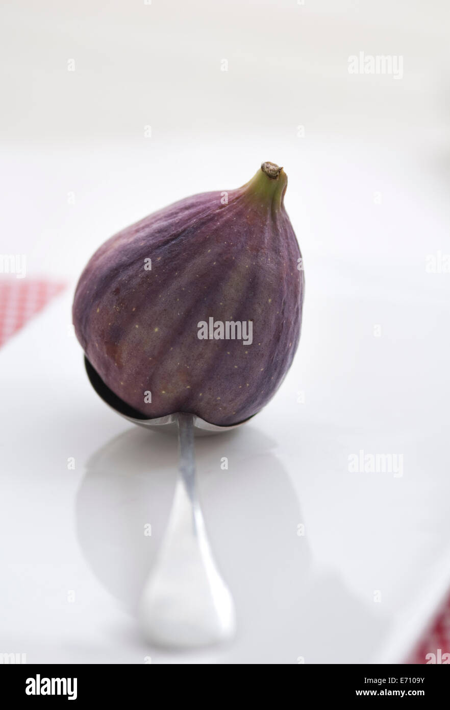 Still life food image of a Fig on a spoon Stock Photo - Alamy