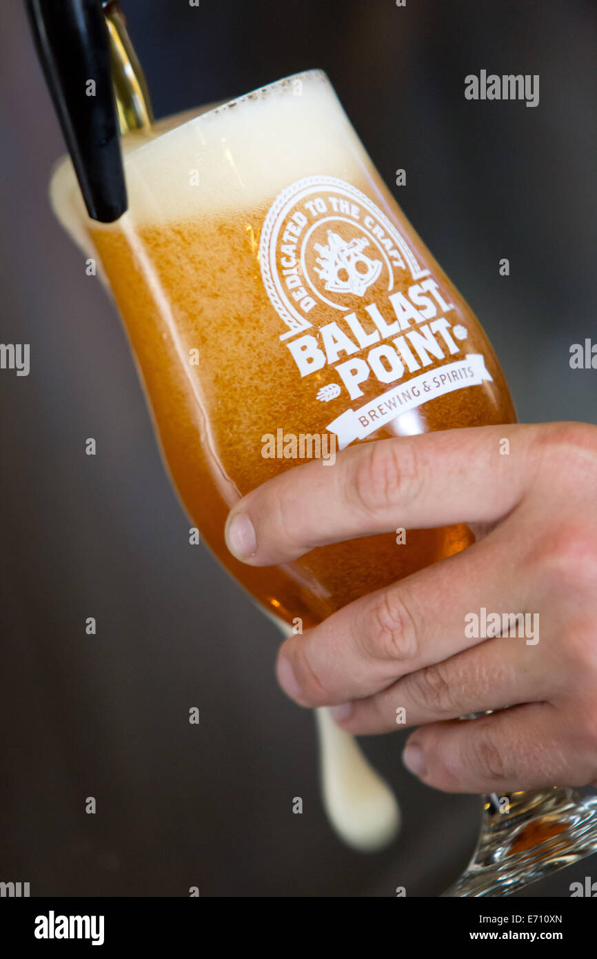 Beer is being poured in the tasting room of the Ballast Point Brewing ...