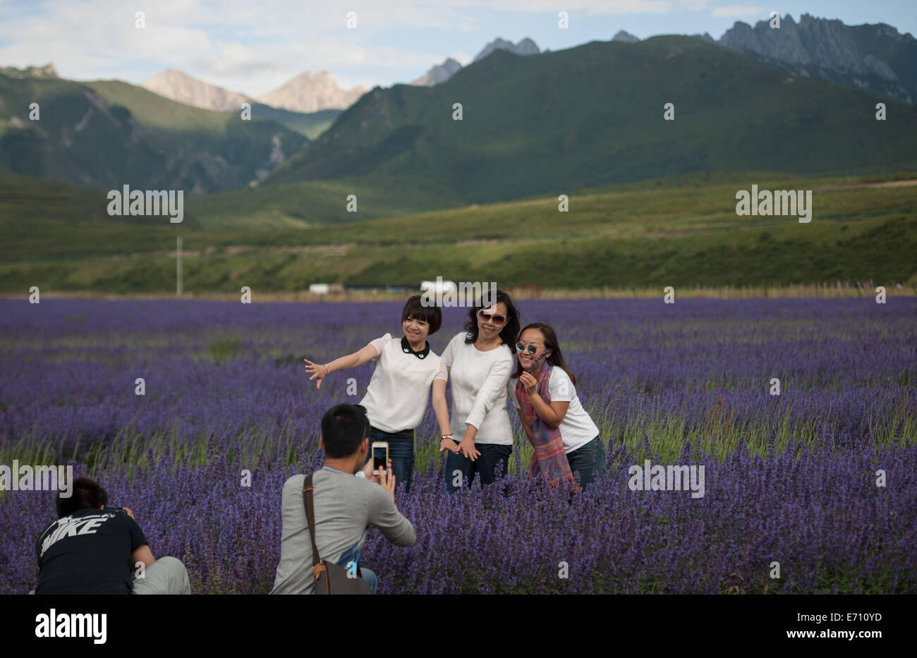 Songpan, China's Sichuan Province. 3rd Sep, 2014. Tourists pose for ...