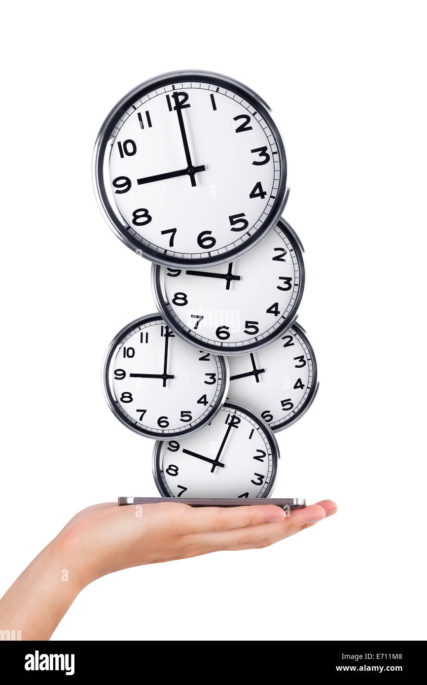 Time concept, hand holding smart phone and analog clocks around it ...