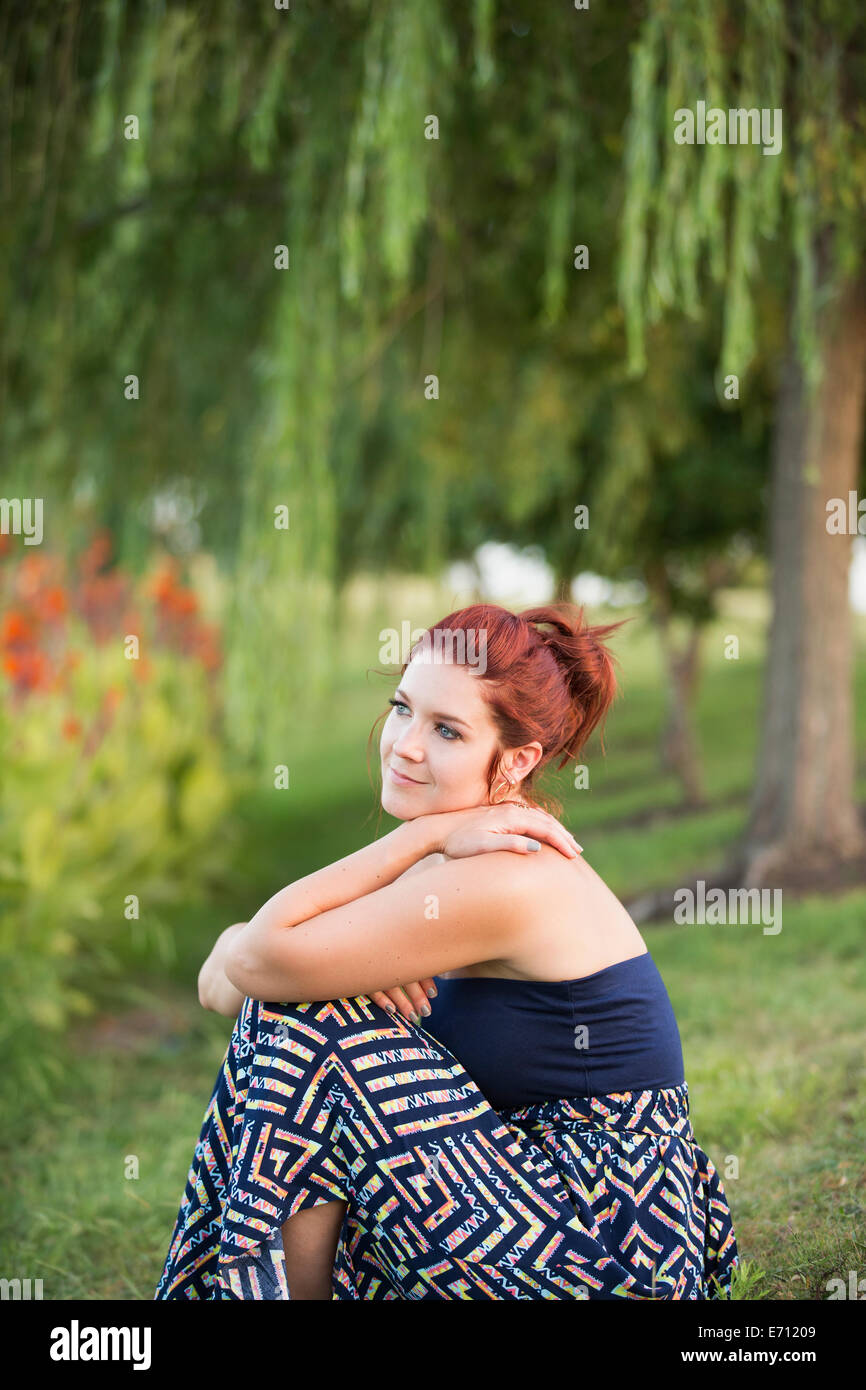 Sitting under tree hi-res stock photography and images - Alamy