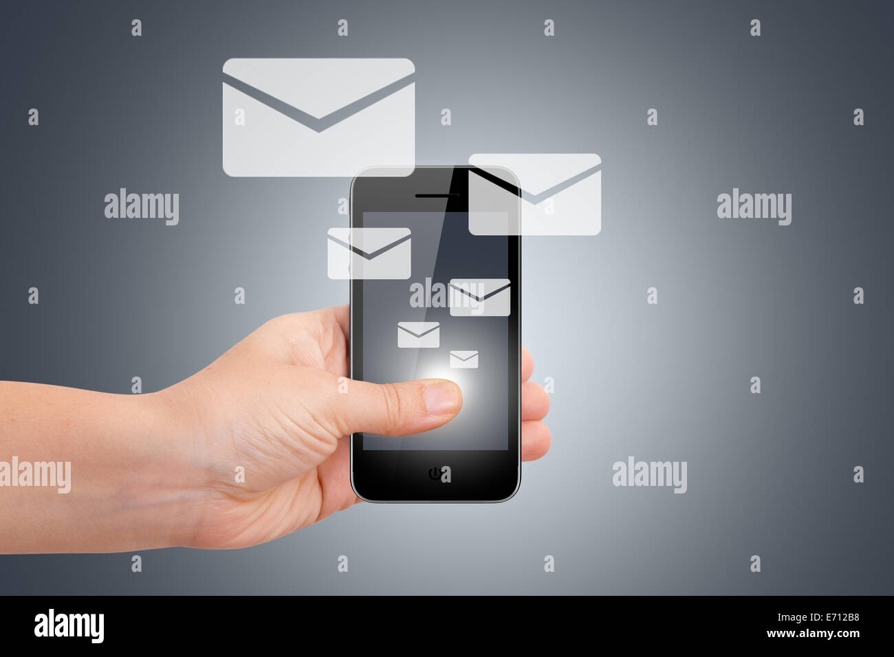 Communication concept with email icons, young female hand holding smart ...