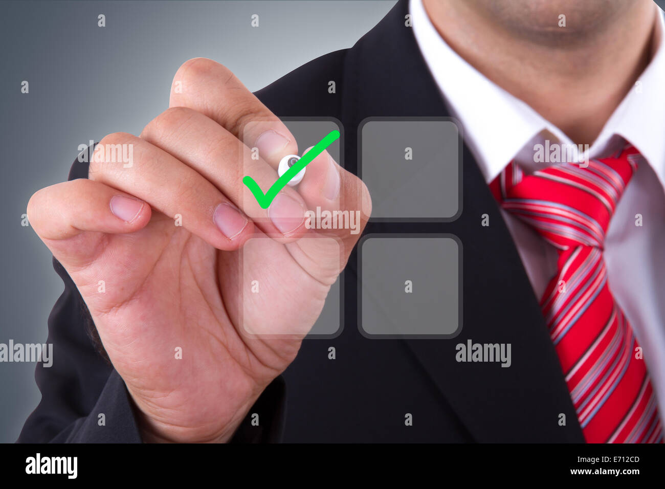 Businessman holding pen and checking check mark of list on digital ...
