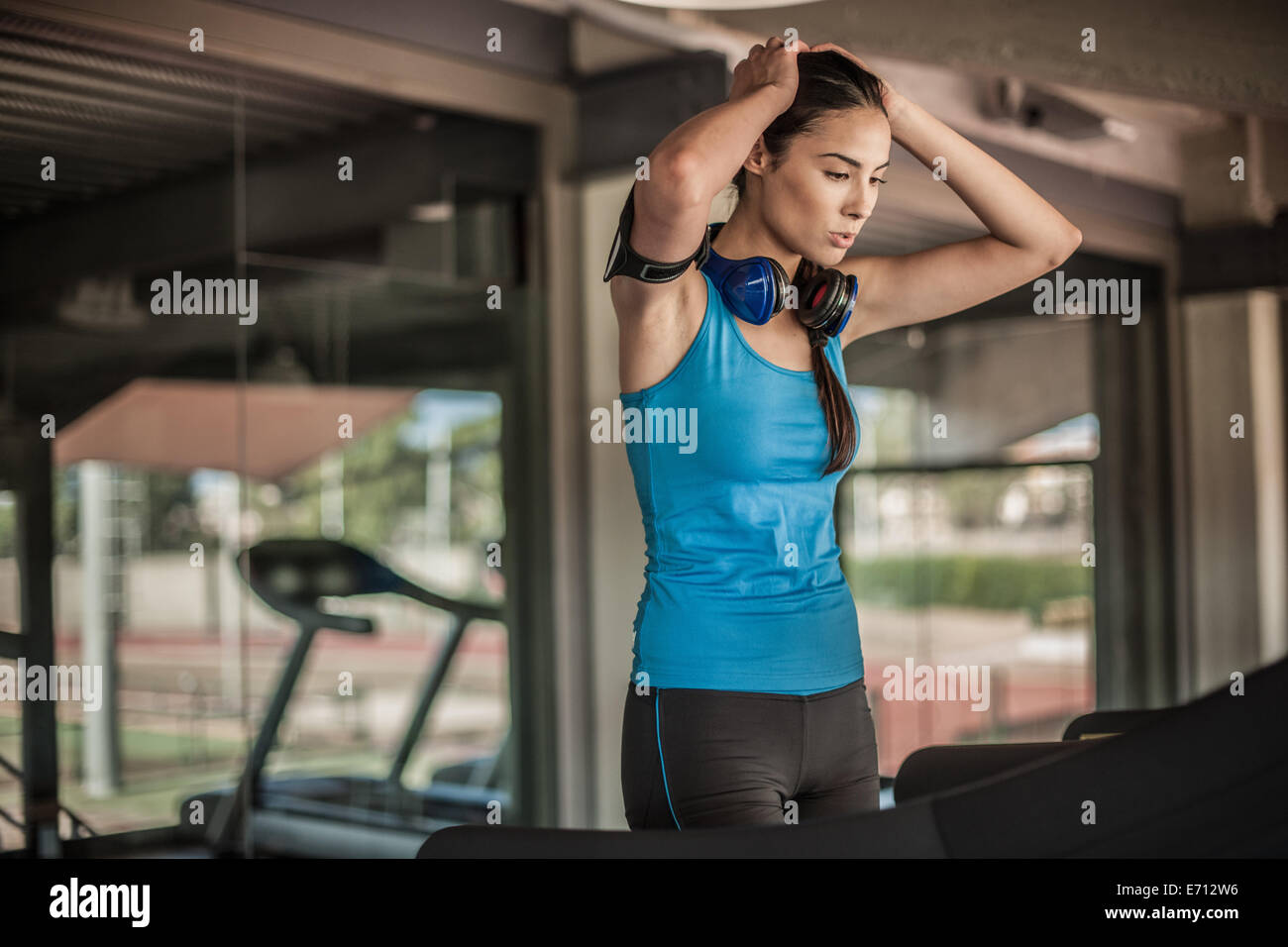 Young woman resting in gym Stock Photo - Alamy