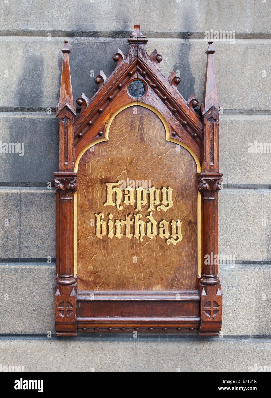 Decorative wooden sign hanging on a concrete wall - Happy birthday ...