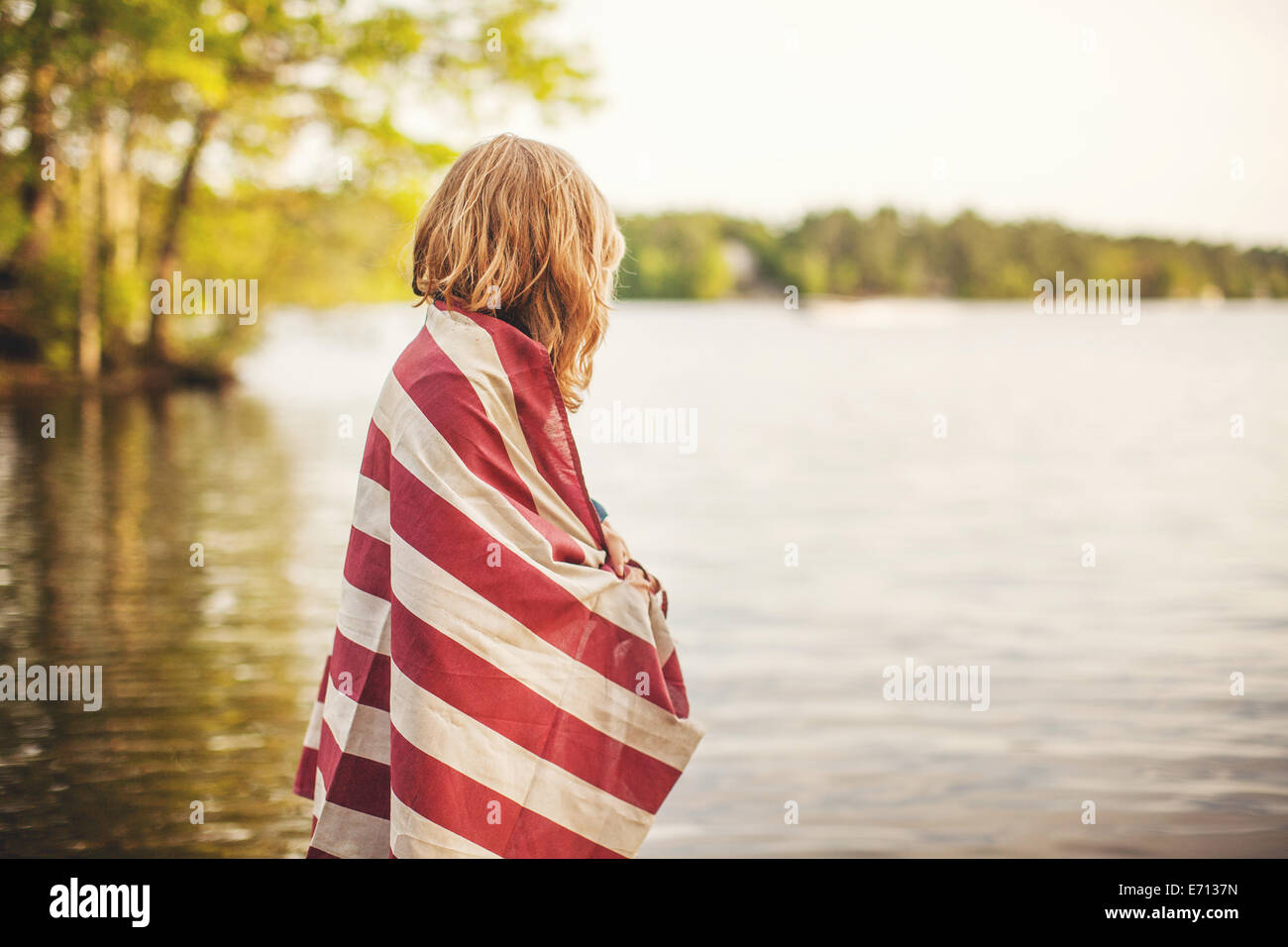 Young woman wrapped in red and white striped fabric Stock Photo - Alamy