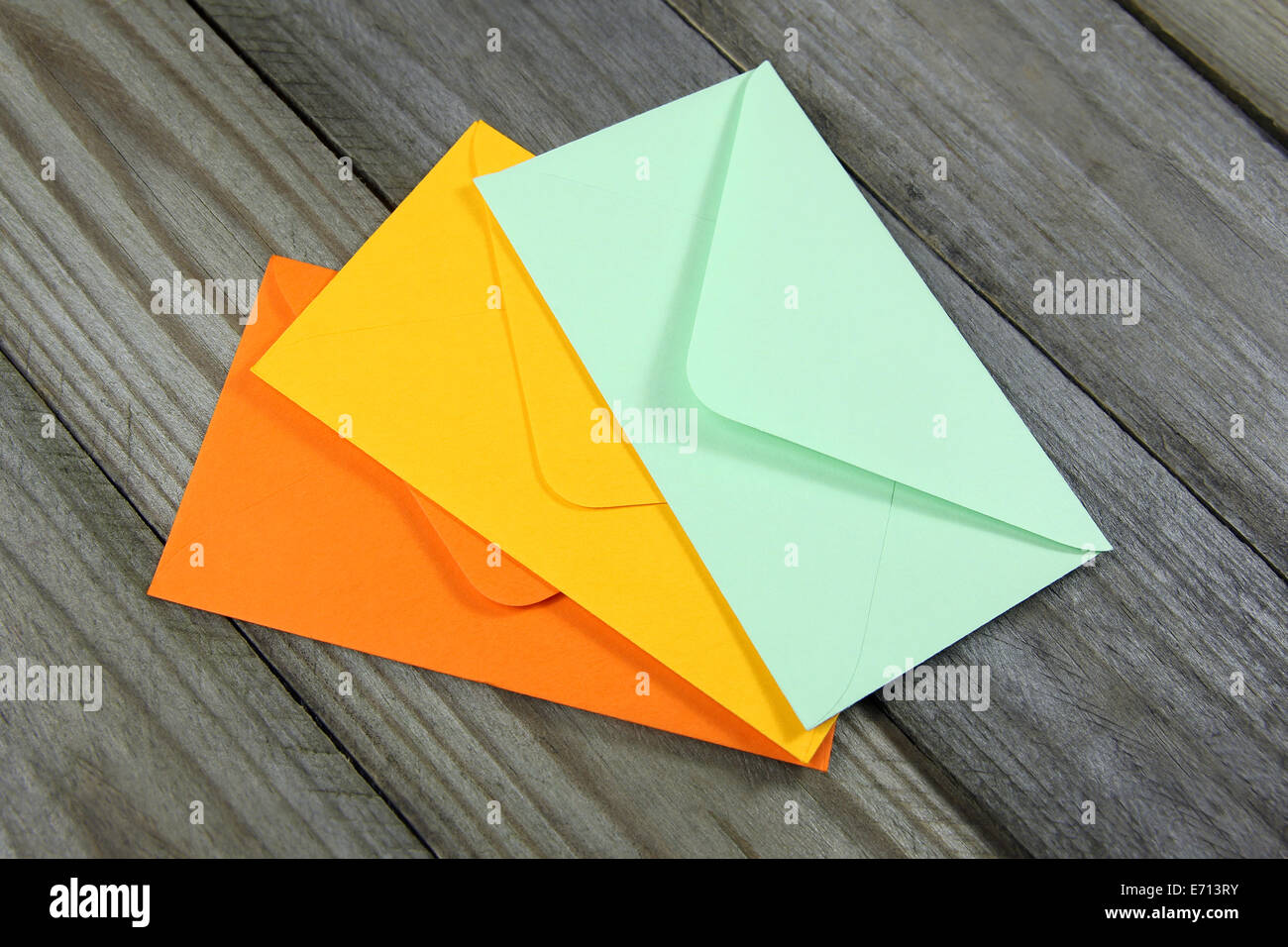 colorful envelopes on wooden background Stock Photo - Alamy