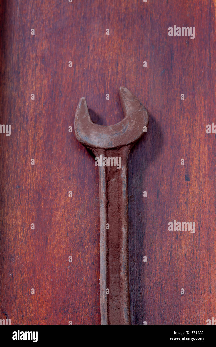 Screw wrench made of chocolate lying on wood Stock Photo - Alamy