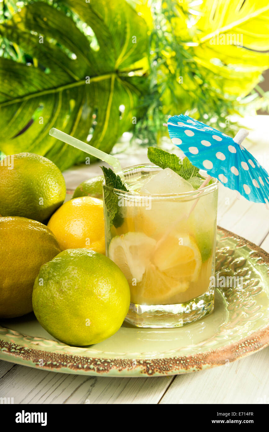 Glass of home made lemonade splash with slices of lemon Stock Photo - Alamy
