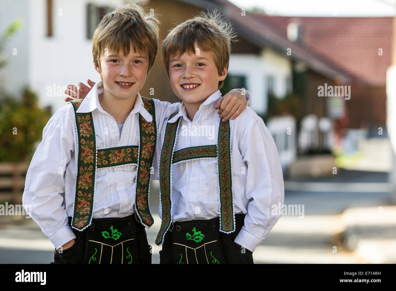 Germany, Murnau, Twin brothers wearing traditional costumes Stock Photo ...
