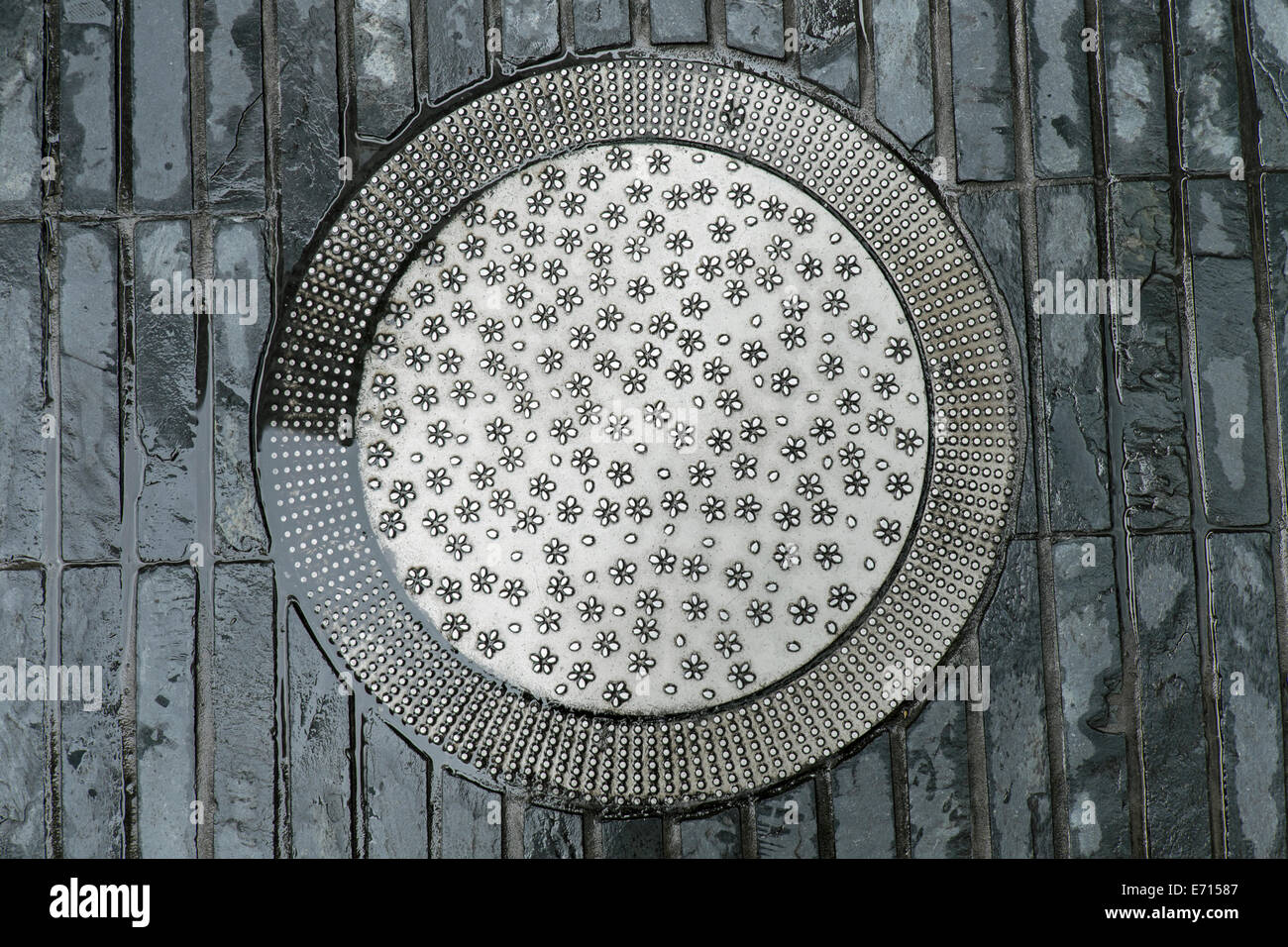 Manhole cover with floral pattern Stock Photo - Alamy