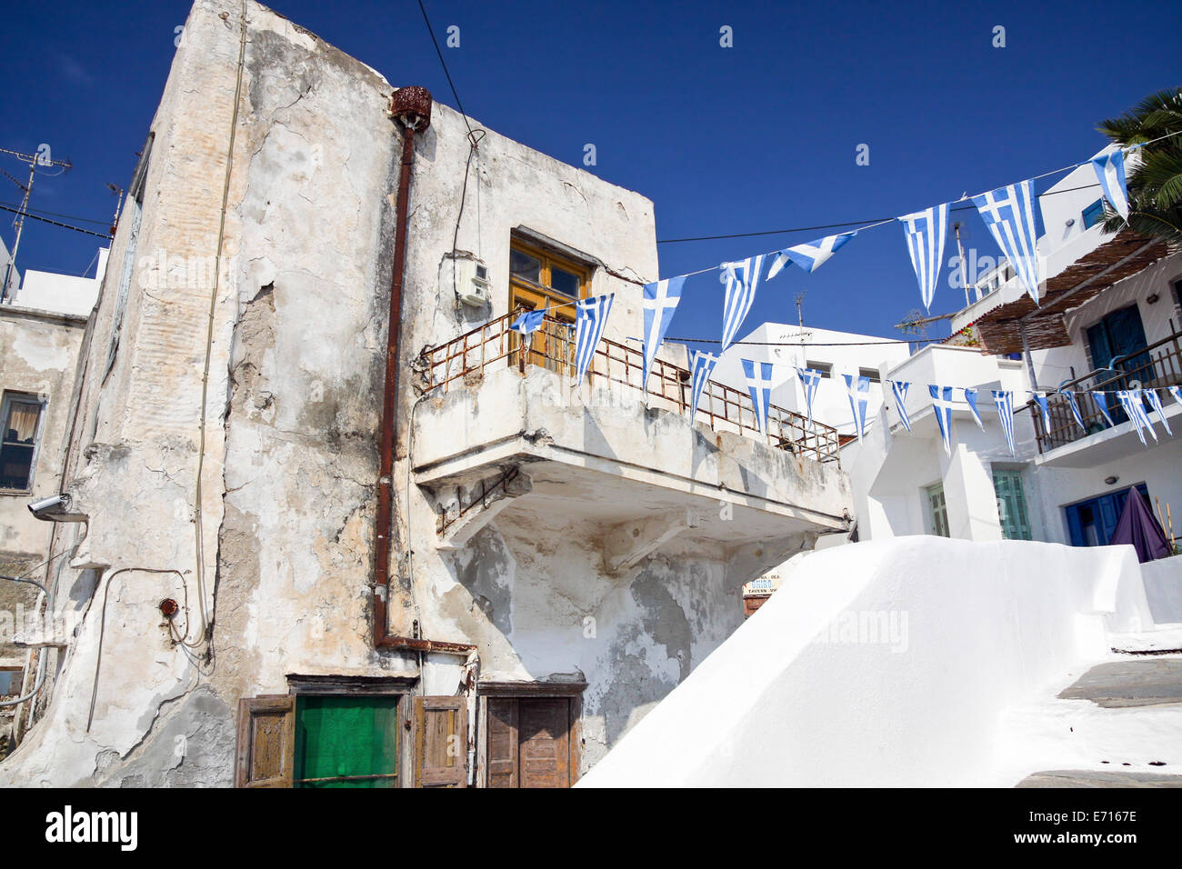 Greece, Cyclades, Naxos, Old house and Greek pennants on a line Stock ...