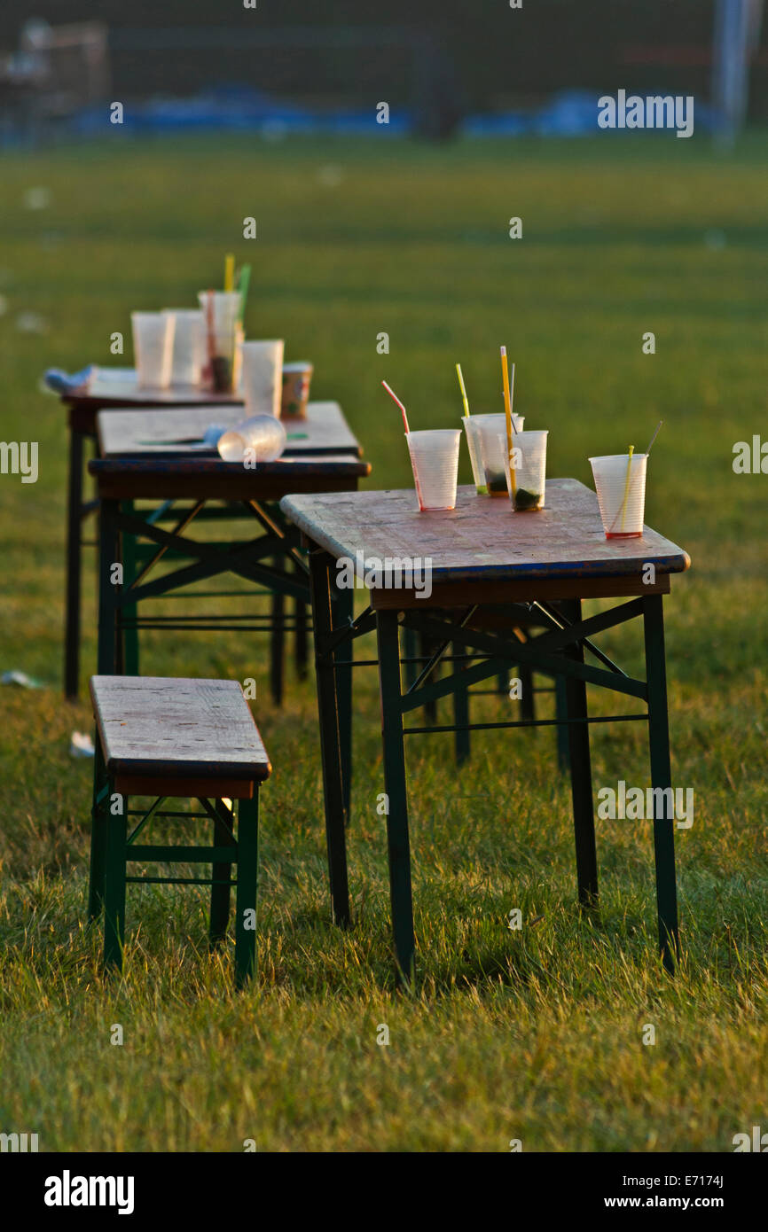 Outdoor beer tables and benches with leftovers of a party Stock Photo ...