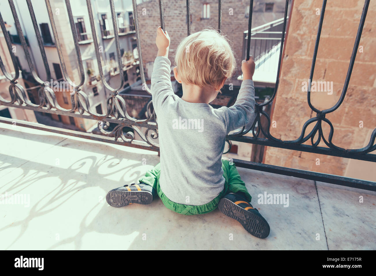 Blond boy on balcony hi-res stock photography and images - Alamy