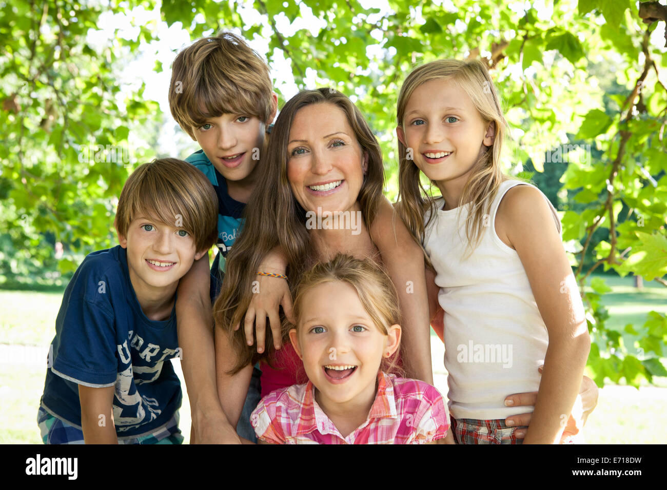 Germany, Berlin, Mother in park with four children Stock Photo - Alamy