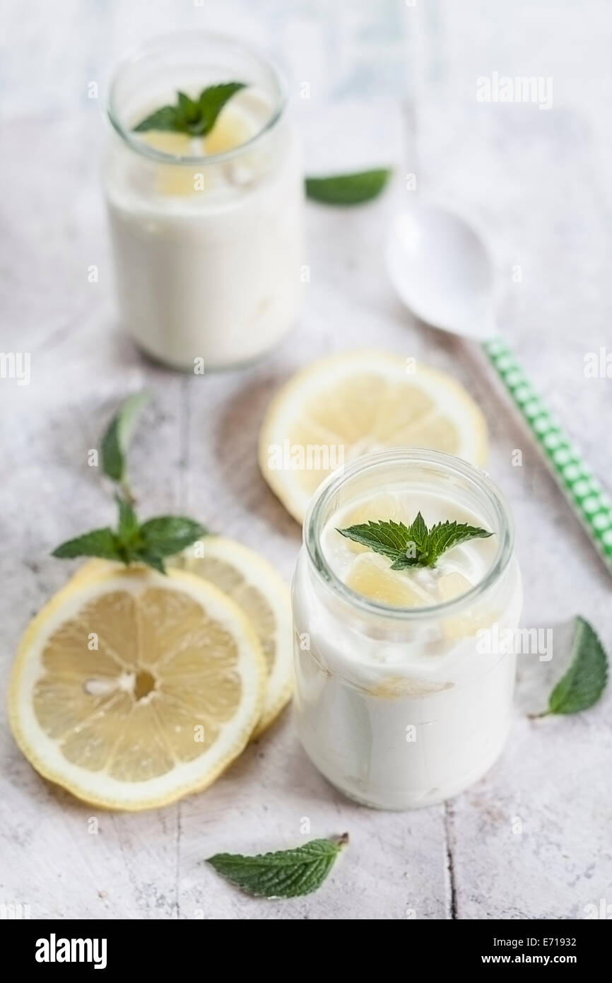 Lemon yogurt with slices of lemon and mint leaves Stock Photo - Alamy