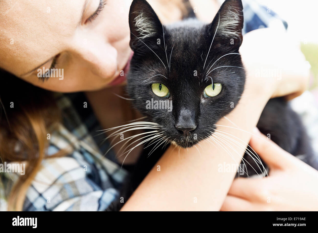 Black woman cuddling cat up close hi-res stock photography and images ...