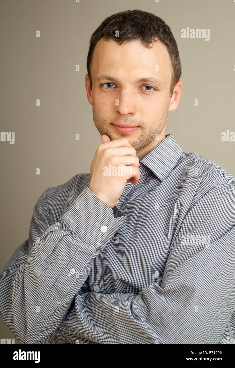 Serious young Caucasian man, casual studio portrait Stock Photo - Alamy Serious young Caucasian man, casual studio portrait Stock Photo - Alamy