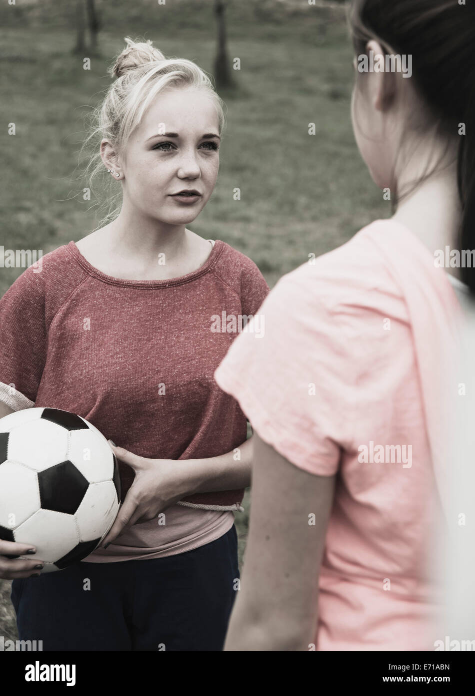 Two friends girls football hi-res stock photography and images - Alamy