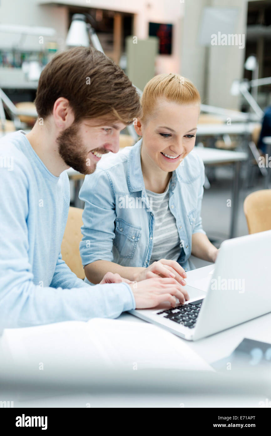 Two students learning in a university library Stock Photo - Alamy