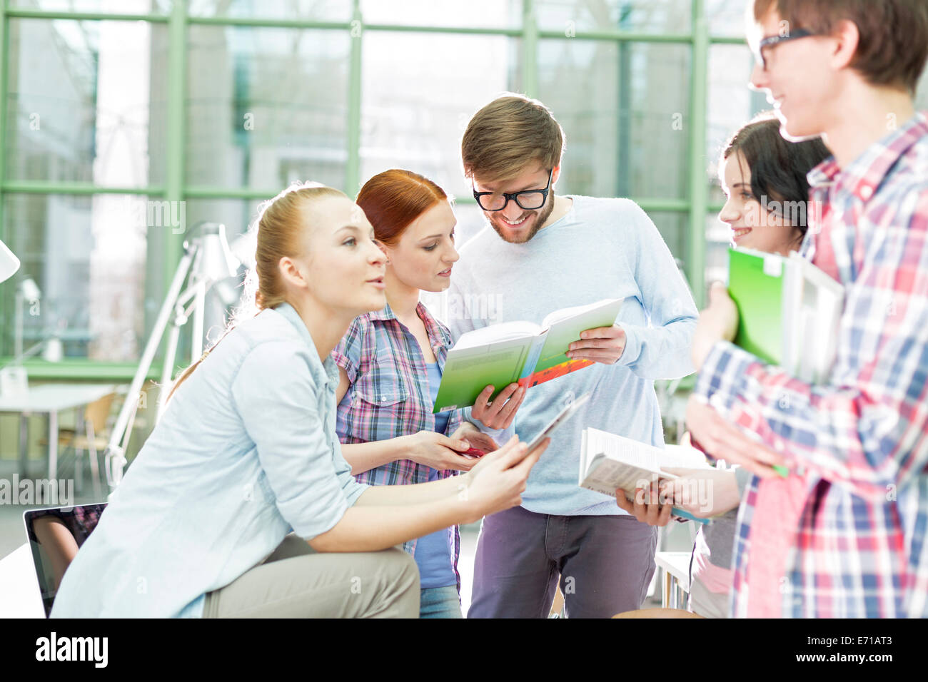 Students in a university library reading books Stock Photo - Alamy