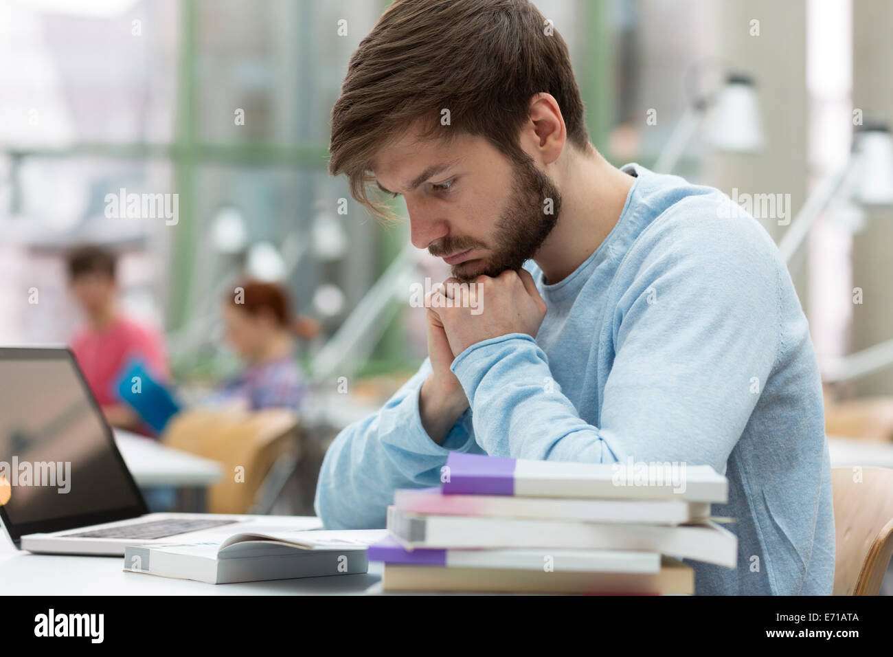 Student learning in a university library Stock Photo - Alamy