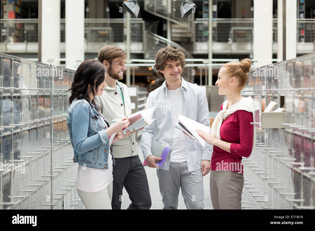 Group of students learning in a university library Stock Photo - Alamy
