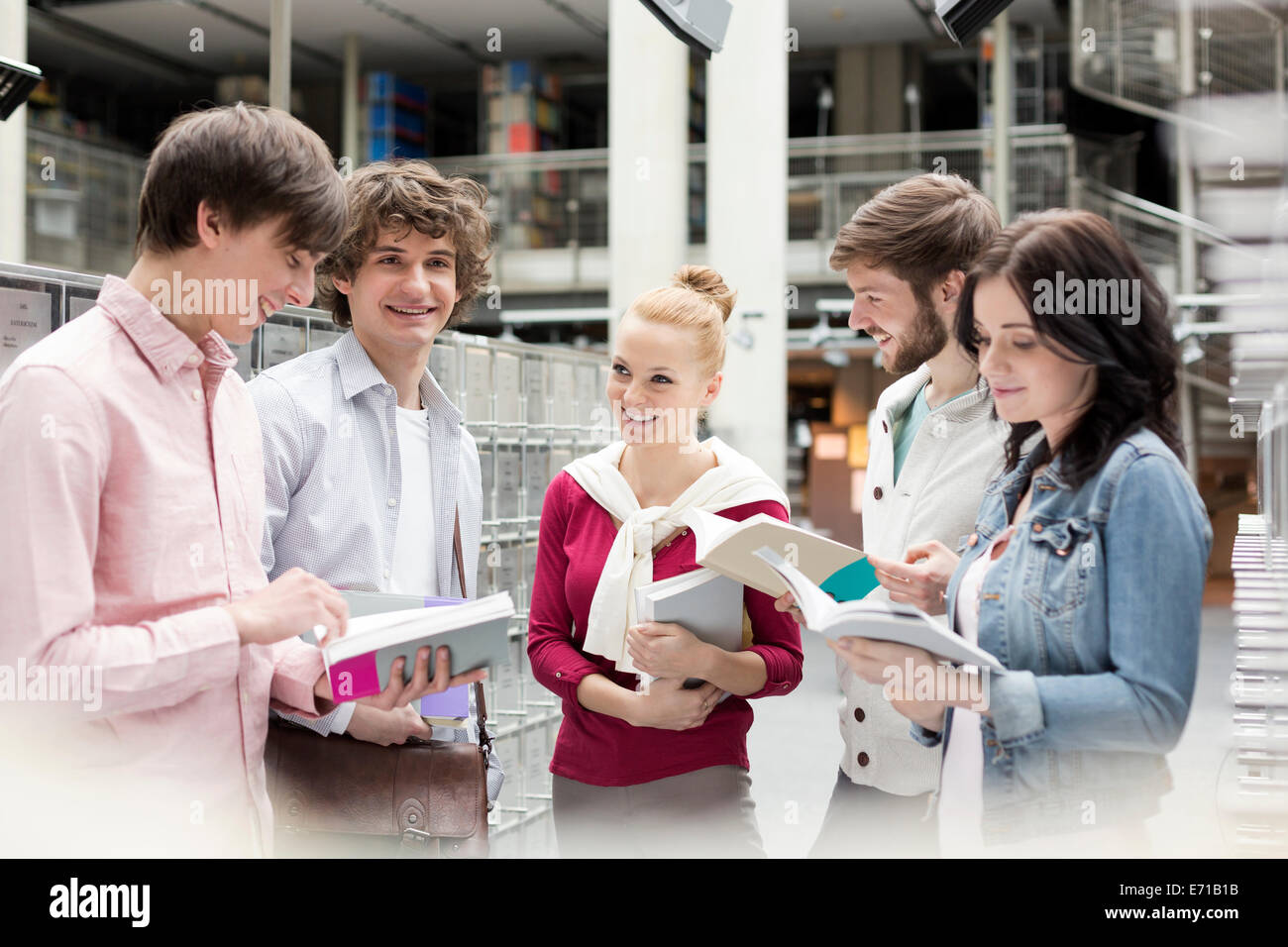 Group of students learning in a university library Stock Photo - Alamy