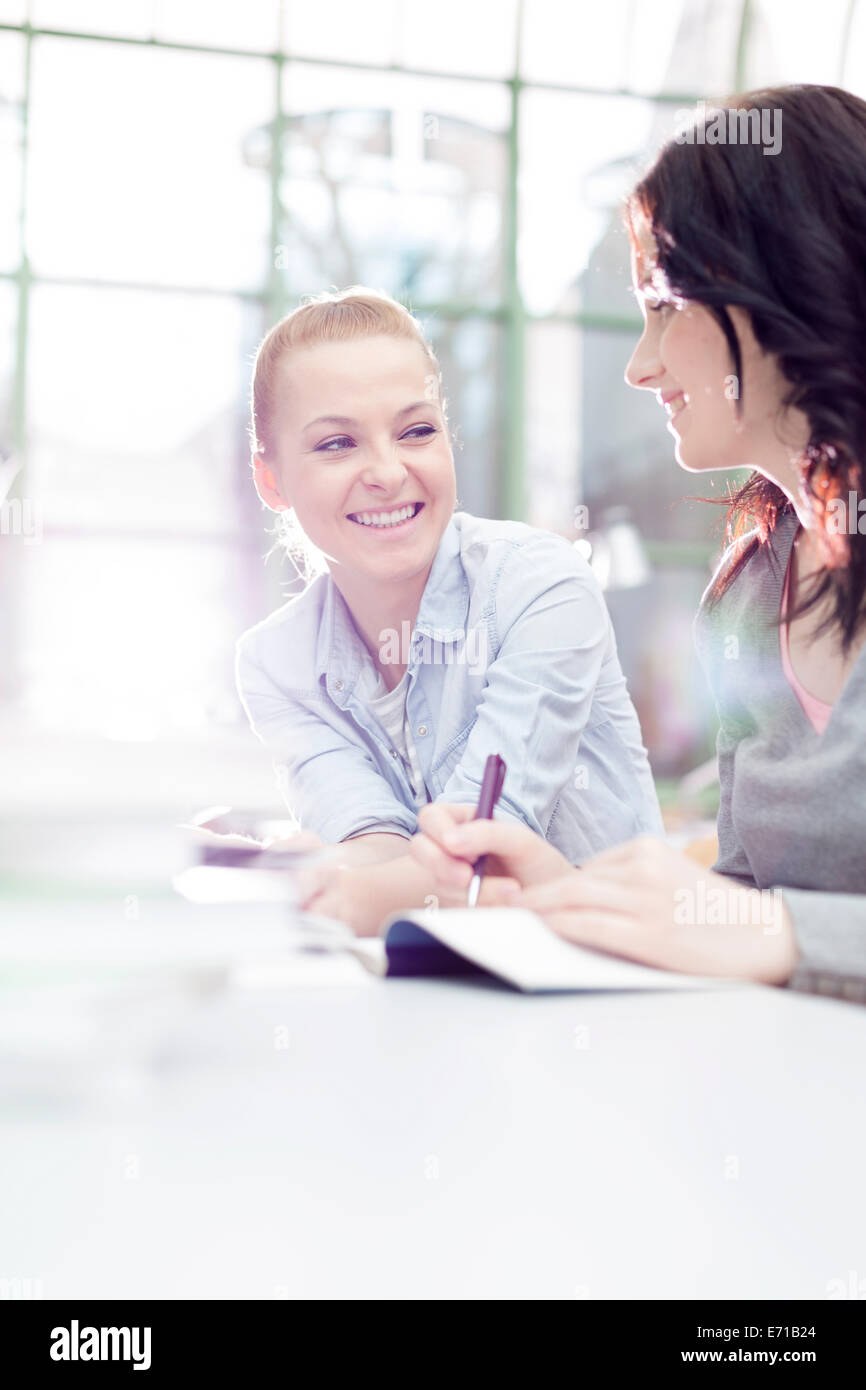 Two students learning in a university library Stock Photo - Alamy