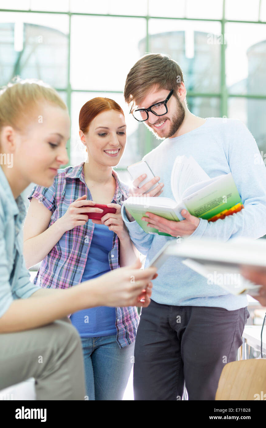 Students in a university library reading books Stock Photo - Alamy