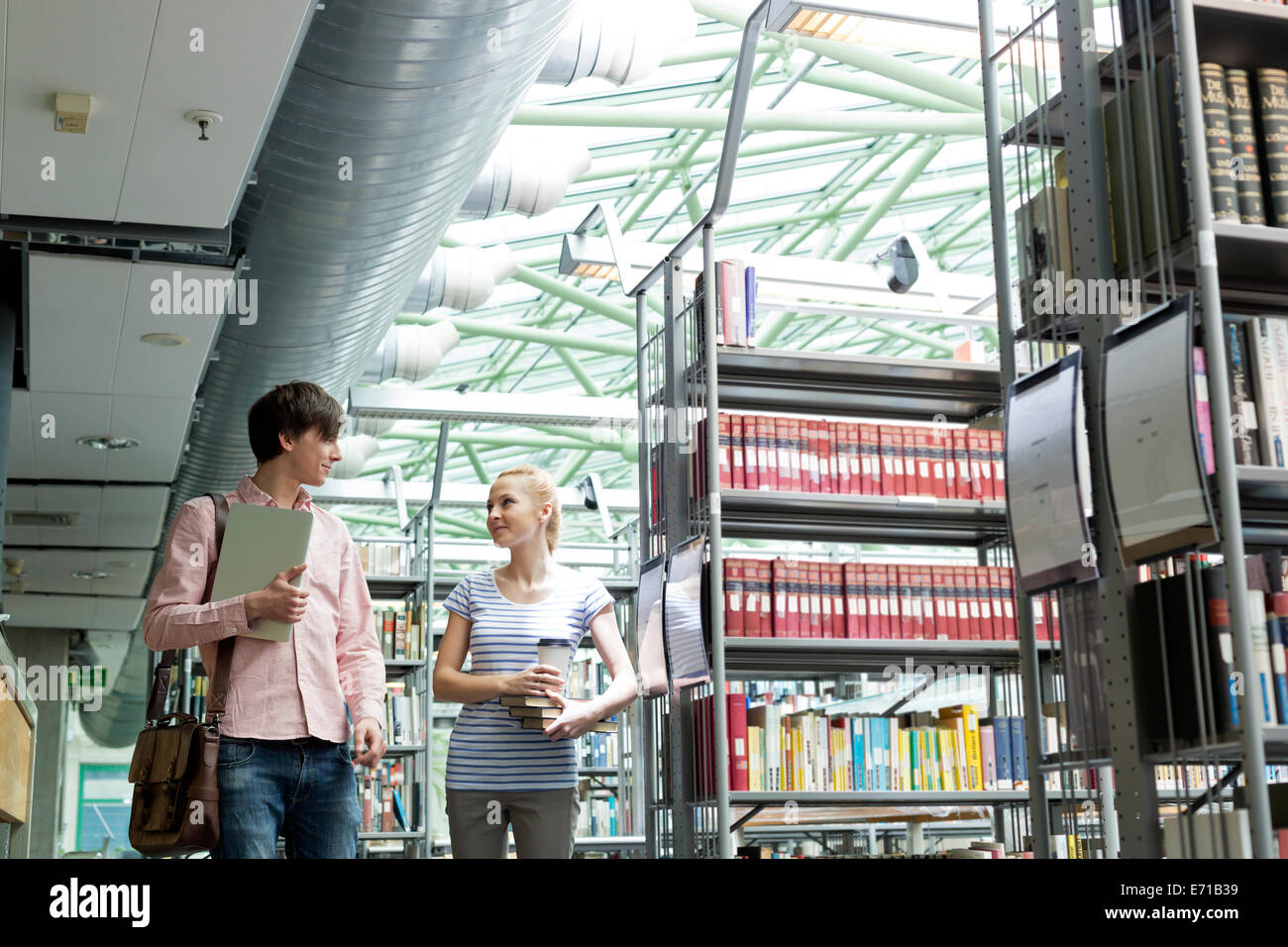 Two students in a university library Stock Photo - Alamy