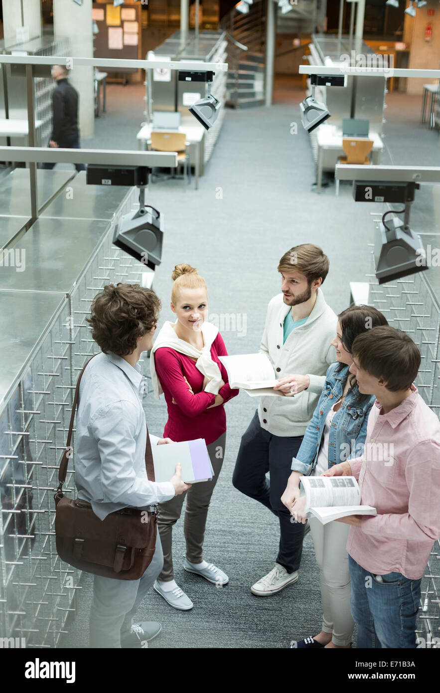 Group of students learning in a university library Stock Photo - Alamy