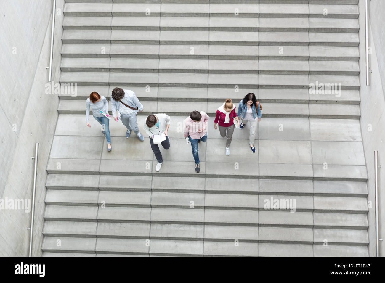 Group of students walking on stairs Stock Photo - Alamy