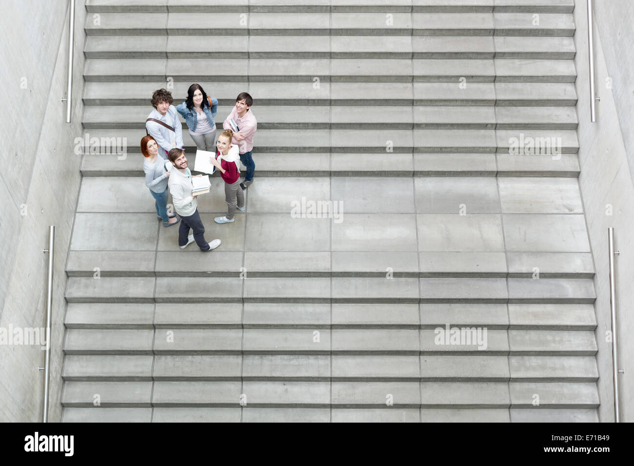 Group of students on stairs Stock Photo - Alamy