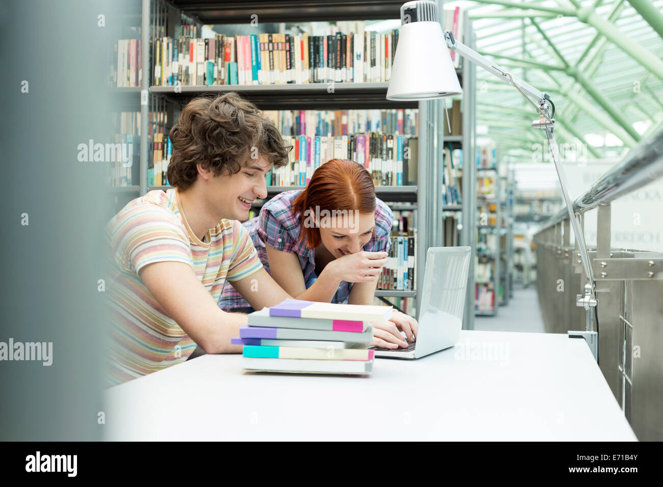 Two adults laptop library hi-res stock photography and images - Alamy