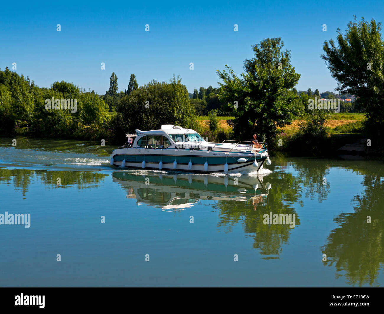 Motor boat cruising on the River Charente in Saintes a town in the ...