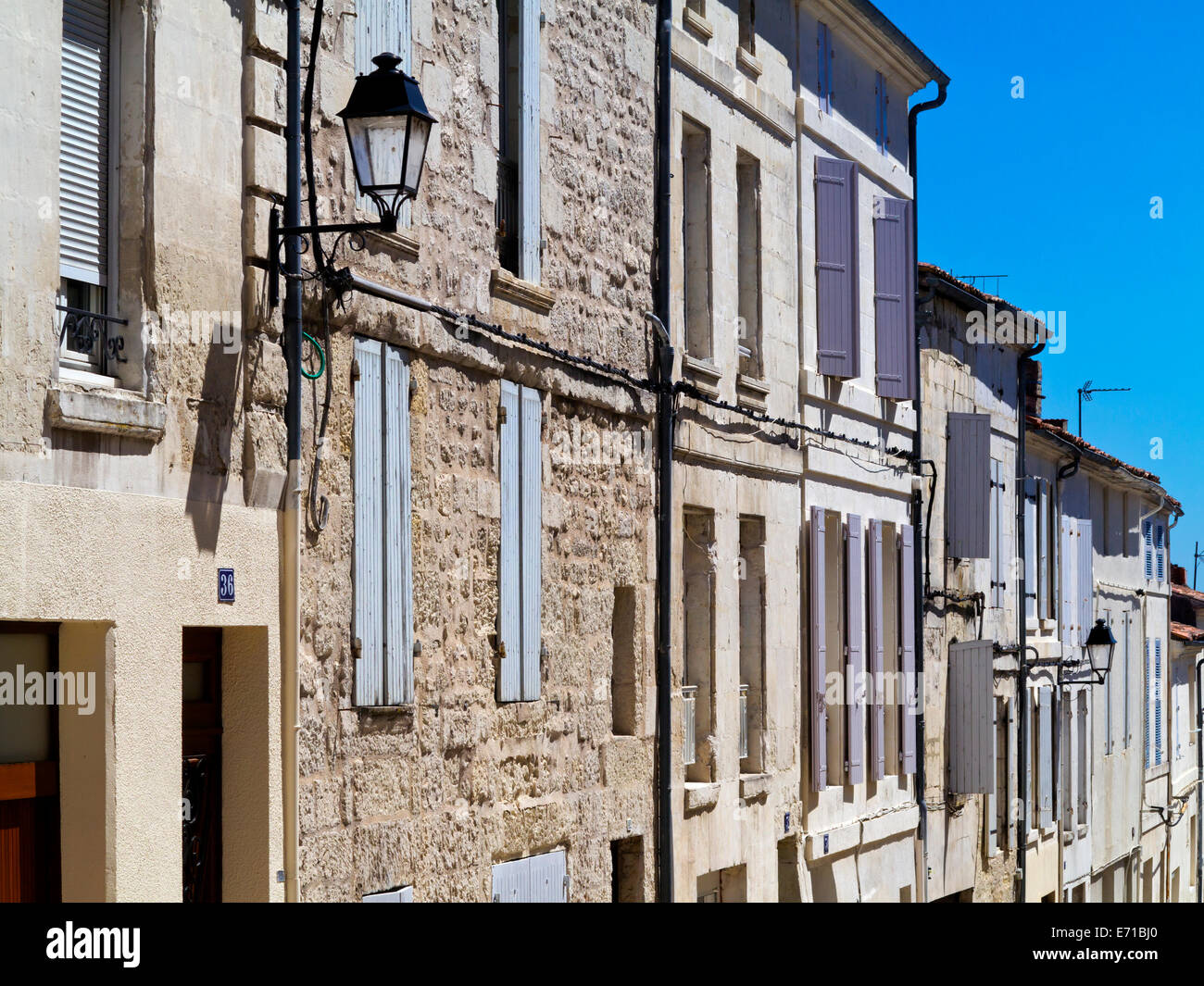 Traditional buildings in a street in the old part of Saintes a town in ...