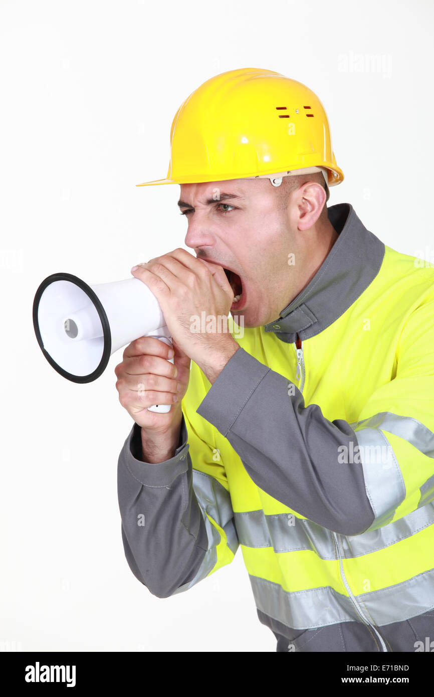 Worker with megaphone Stock Photo - Alamy