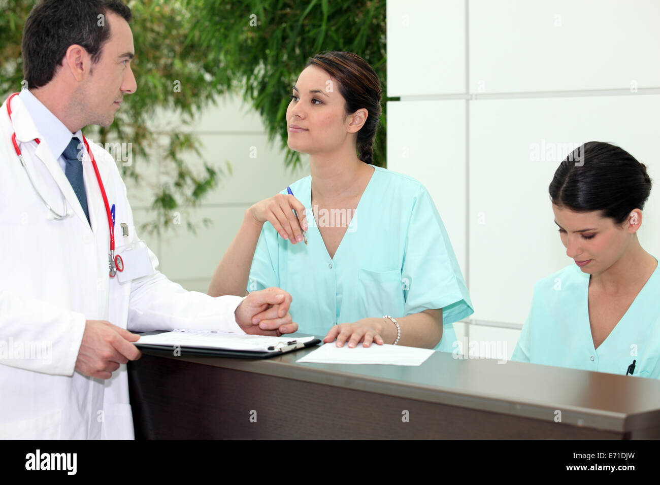 Doctor in the hospital reception Stock Photo - Alamy