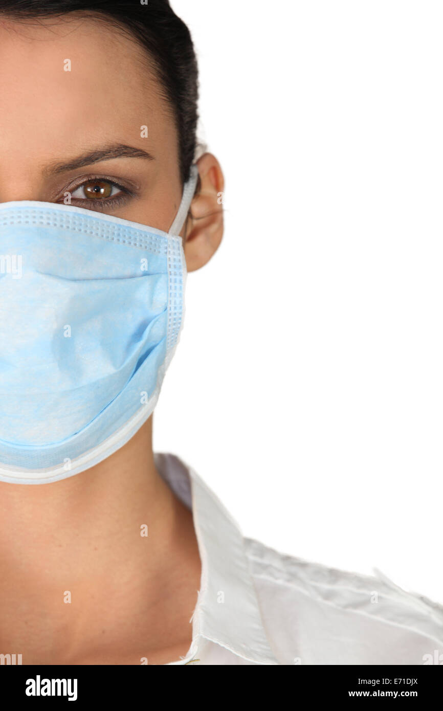 Young woman in a surgical mask Stock Photo - Alamy