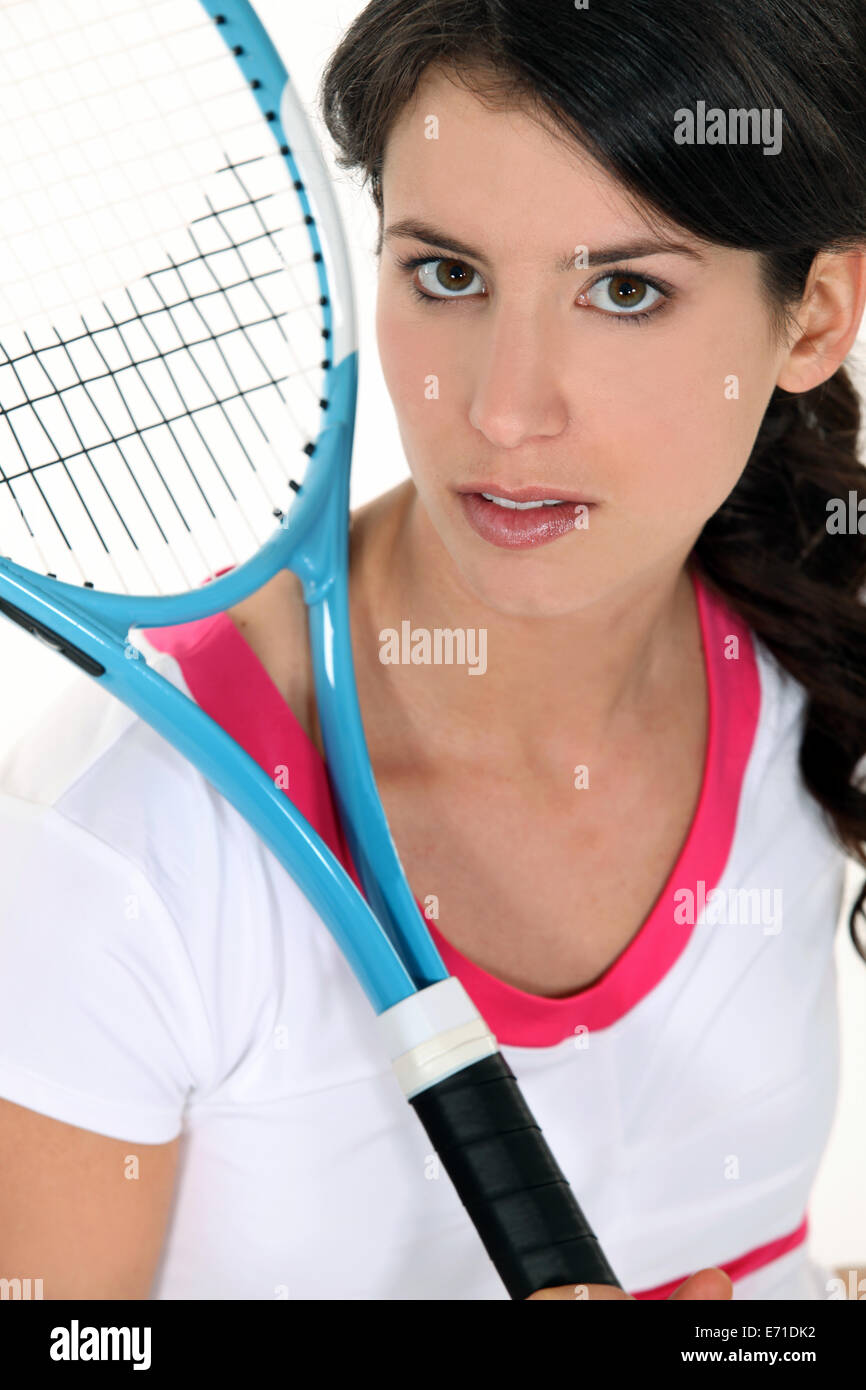 Woman holding a tennis racket Stock Photo - Alamy