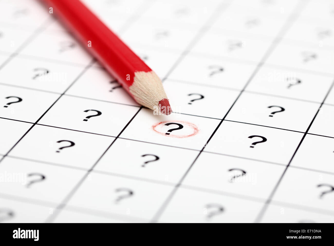 Question Marks and red pencil. Closeup Stock Photo - Alamy